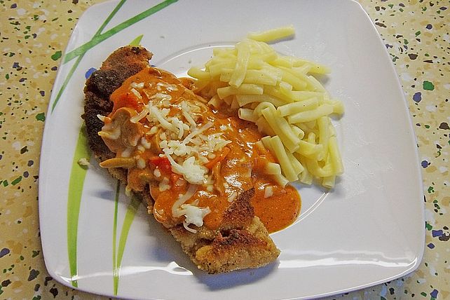 Schweineschnitzel "Mailand" paniert, mit Käse garniert von boto| Chefkoch